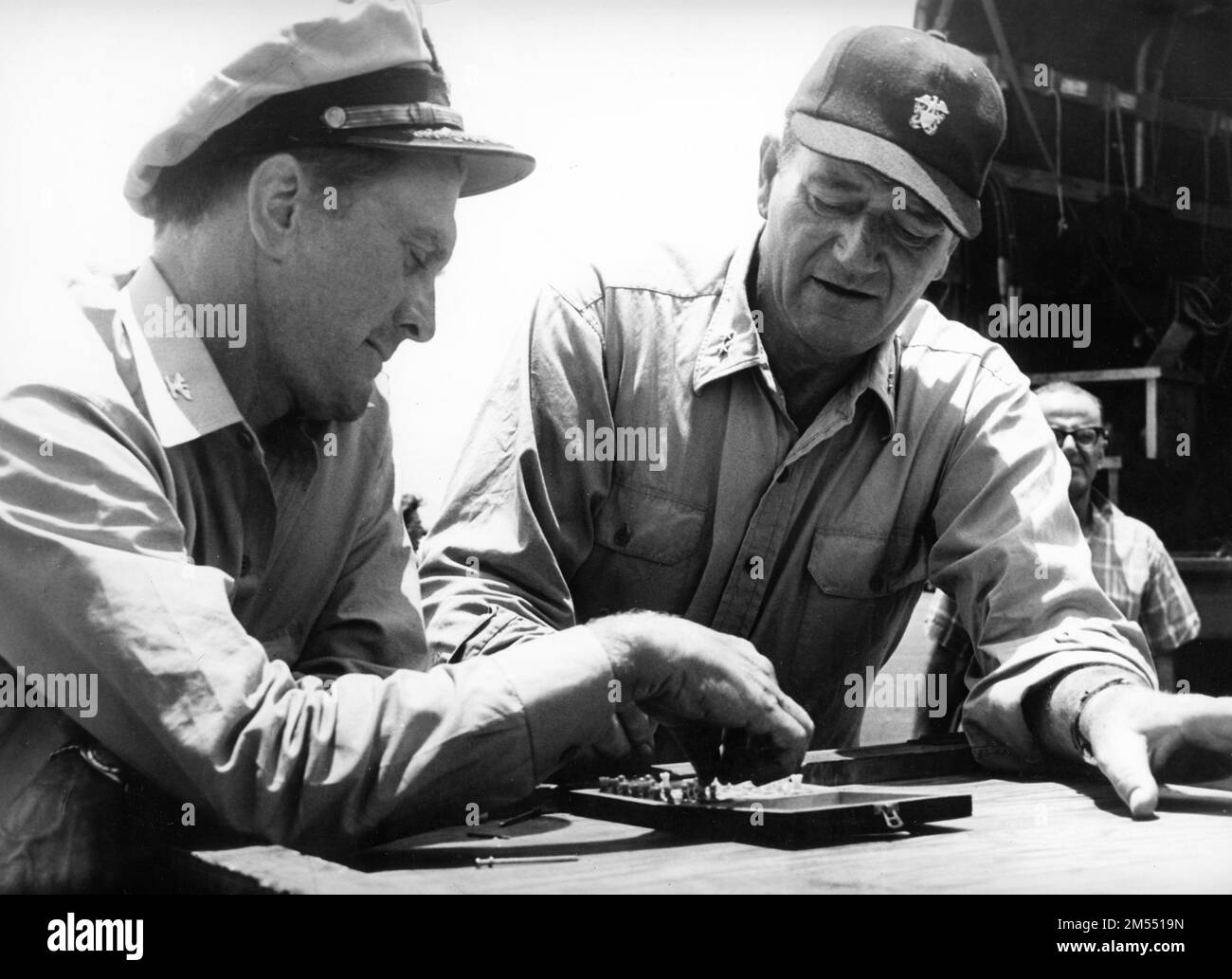 KIRK DOUGLAS and JOHN WAYNE on set location candid playing Chess during ...