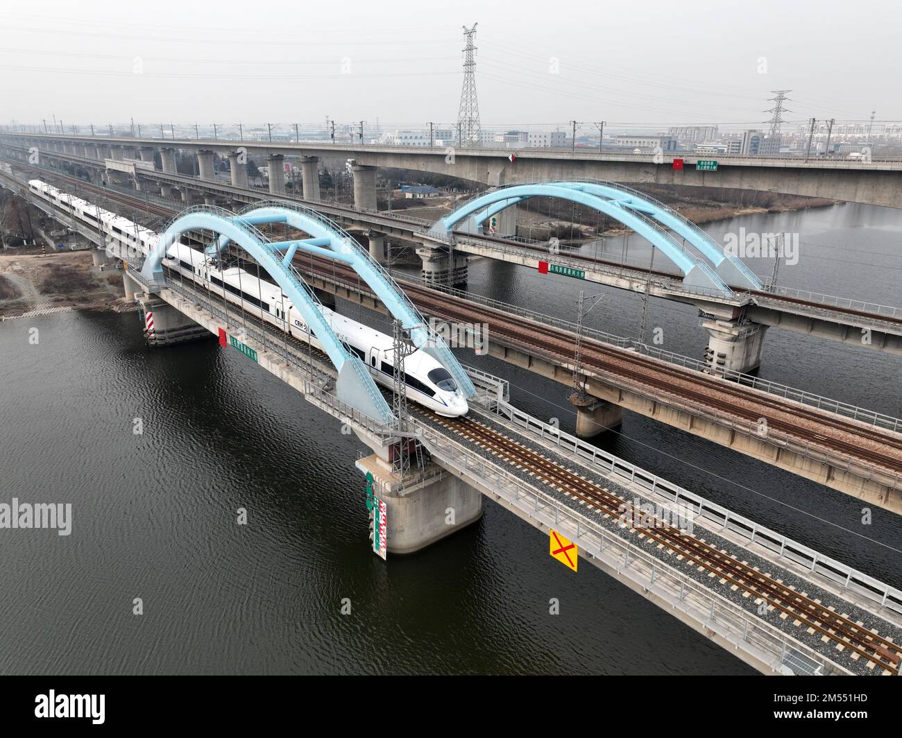 LIANYUNGANG, CHINA - DECEMBER 26, 2022 - A bullet train passes through ...