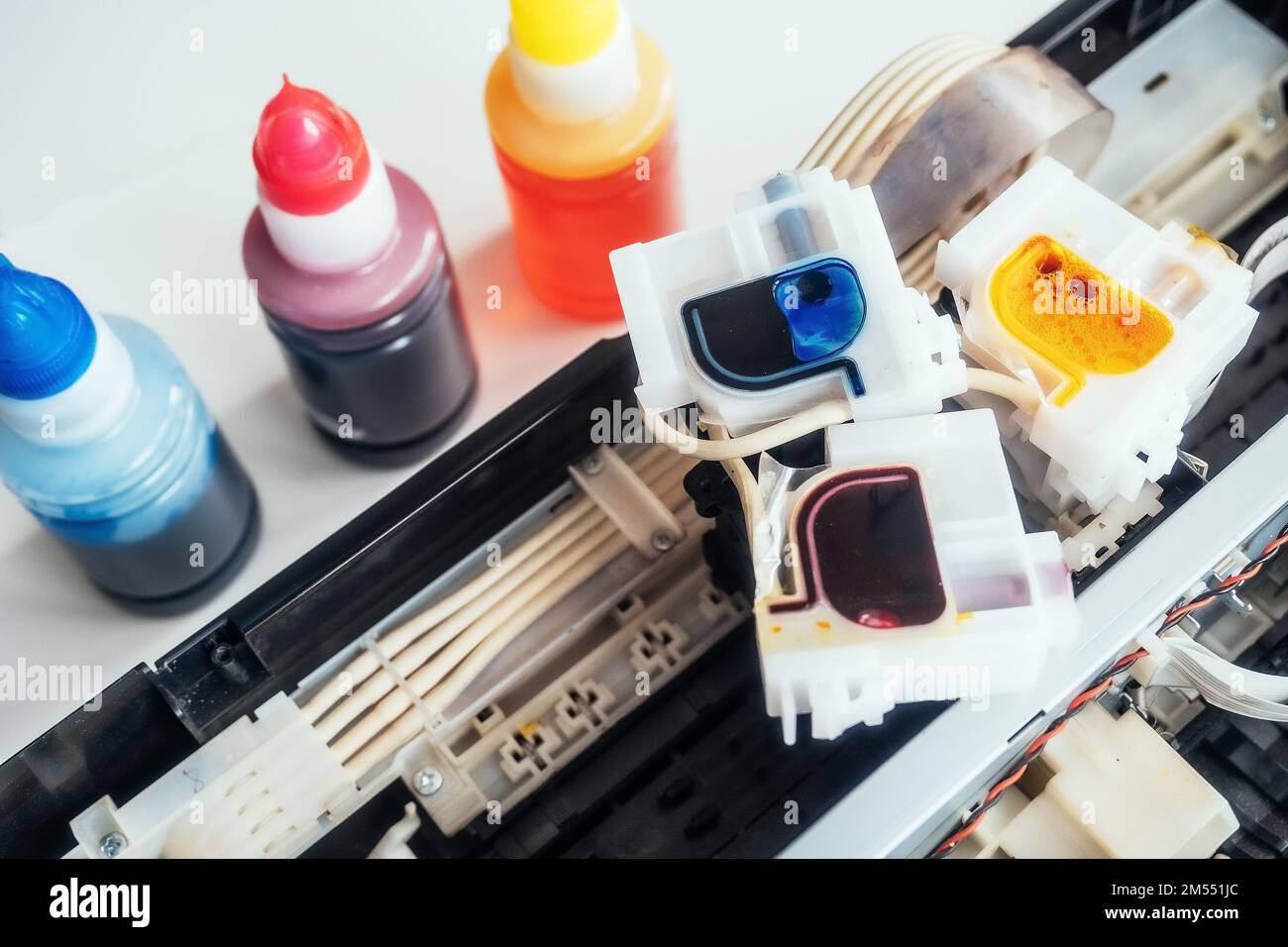 Filling inkjet printer with colored ink. Service for repair and ...
