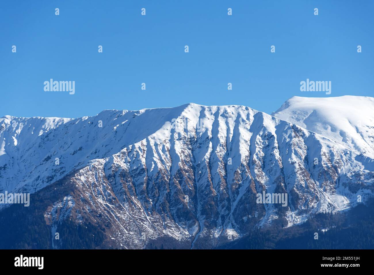 Mountain snowy landscape forest, mountain range pass blue sky Stock ...