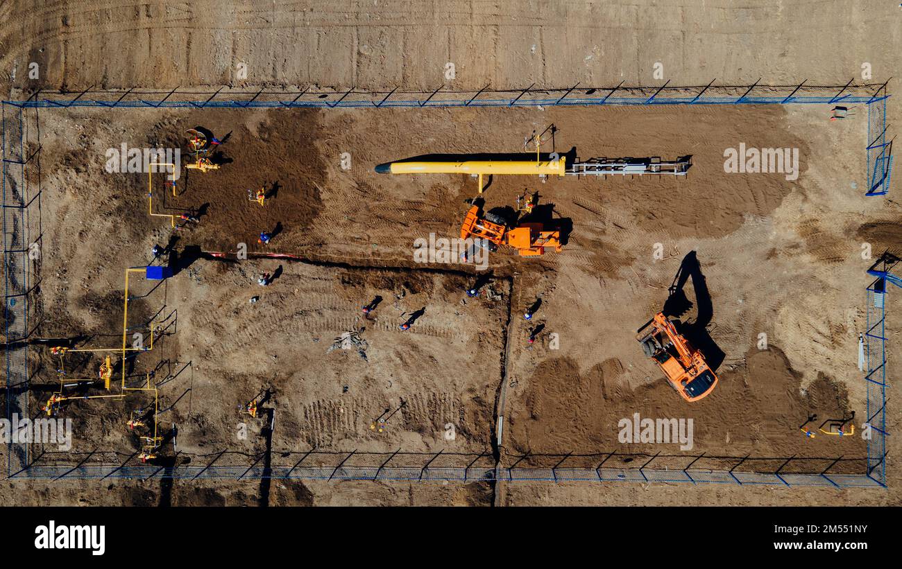 Aerial view excavator and construction workers working on construction ...