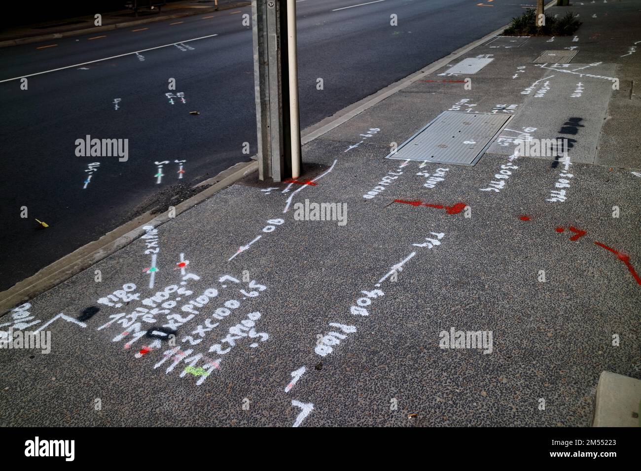 Sprayed obscure road construction markings on asphalt and pavement ...