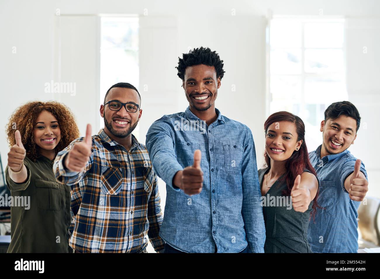 Keep up the amazing work. Portrait of a team of happy colleagues ...