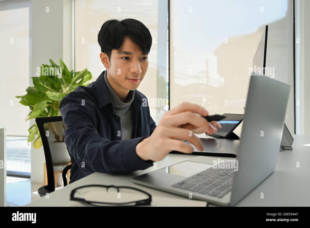 Start up businessman pointing on screen, checking online information on ...