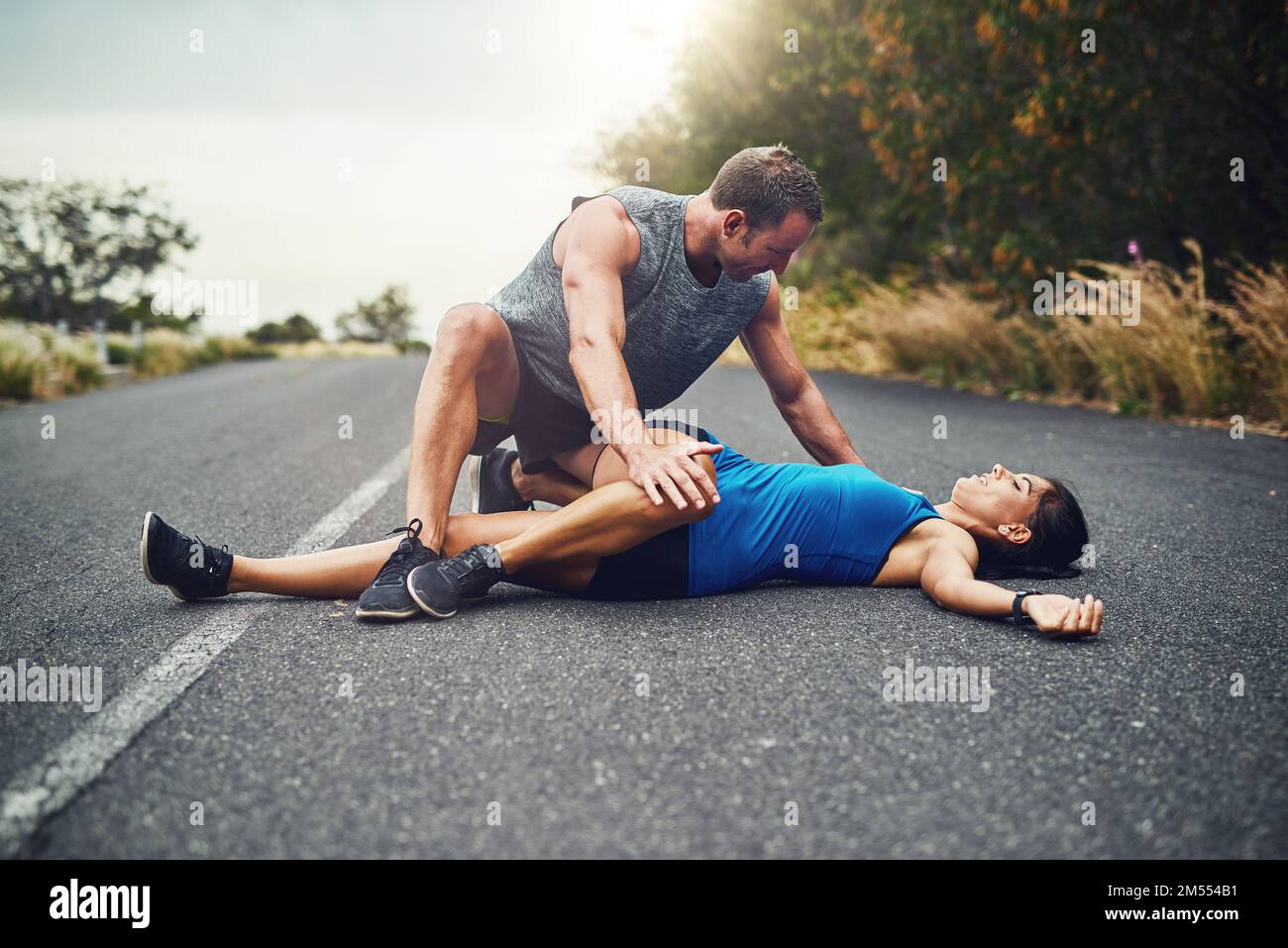 The proper way to stretch. a young attractive couple training for a ...
