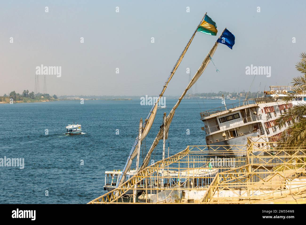 Felucca (river boat) on the Nile, with the Sahara behind in Aswan ...