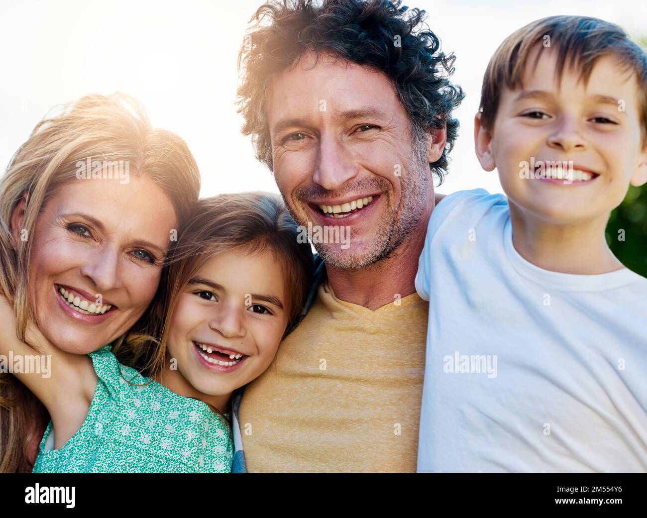 Our family is our first priority. Portrait of a happy family spending ...