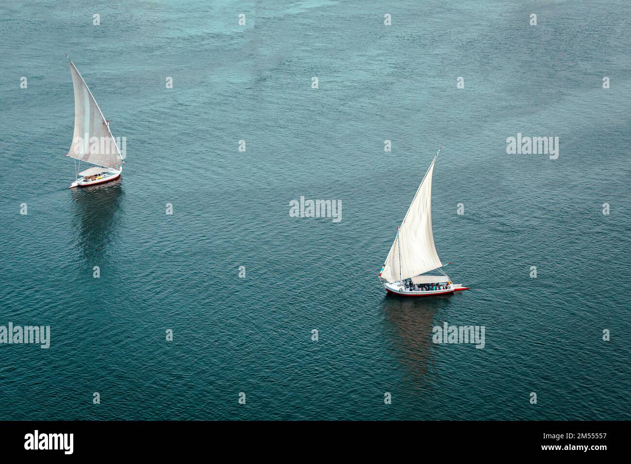 Felucca (river boat) on the Nile, with the Sahara behind in Aswan ...