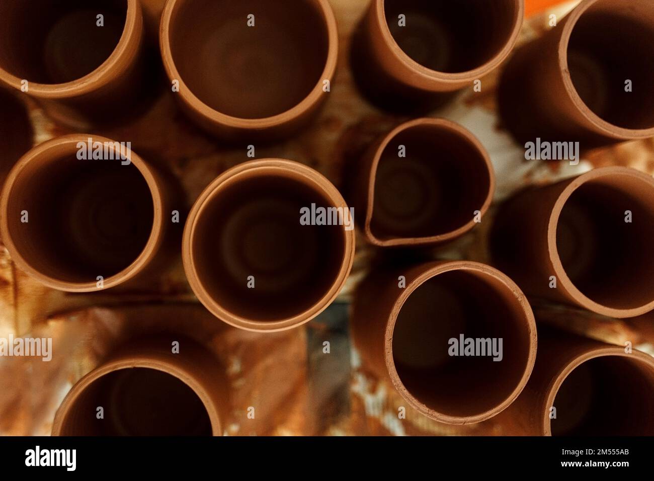 Handmade ceramic cups top view. Designer ceramic plates, bowls, cups ...