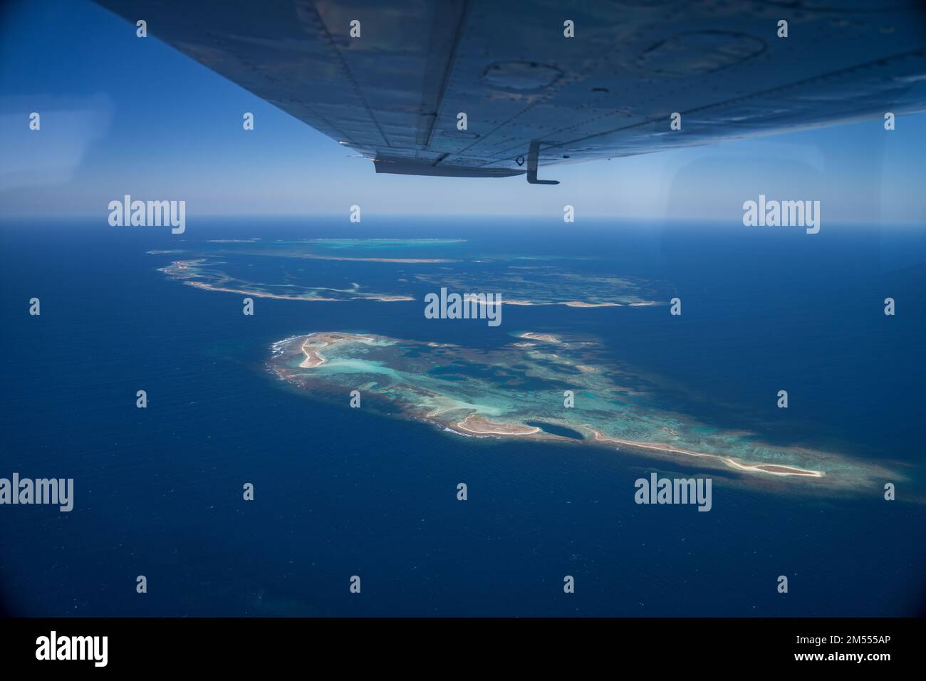An aerial view islands surrounded by blue ocean Stock Photo - Alamy