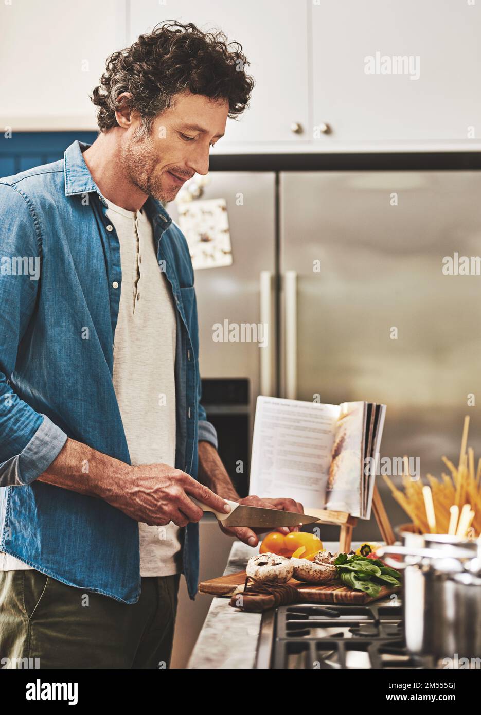 Cooking is a skill every bachelor should have. a bachelor chopping ...