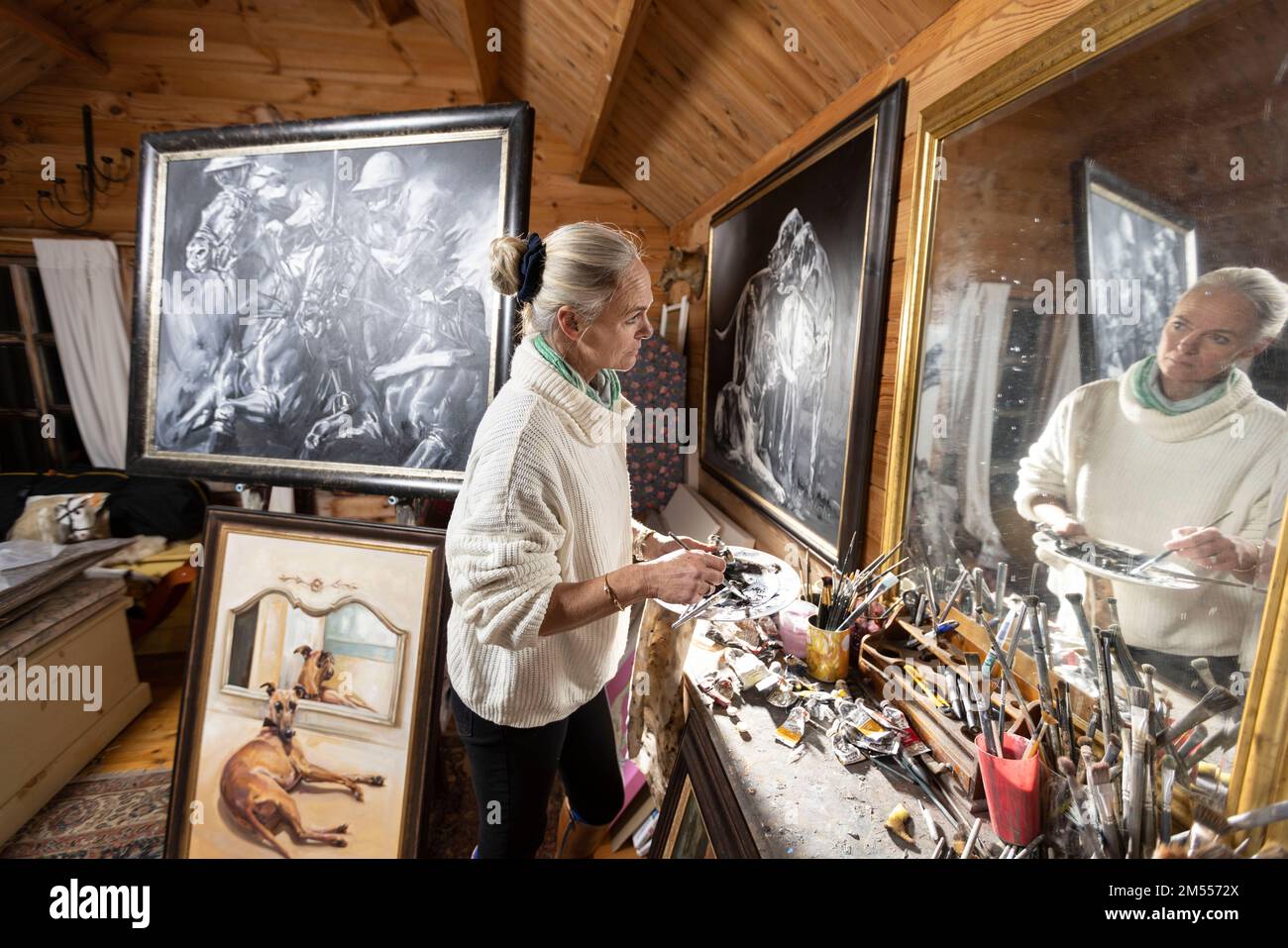 Picture shows artist Debbie Harris working in her garden studio based ...