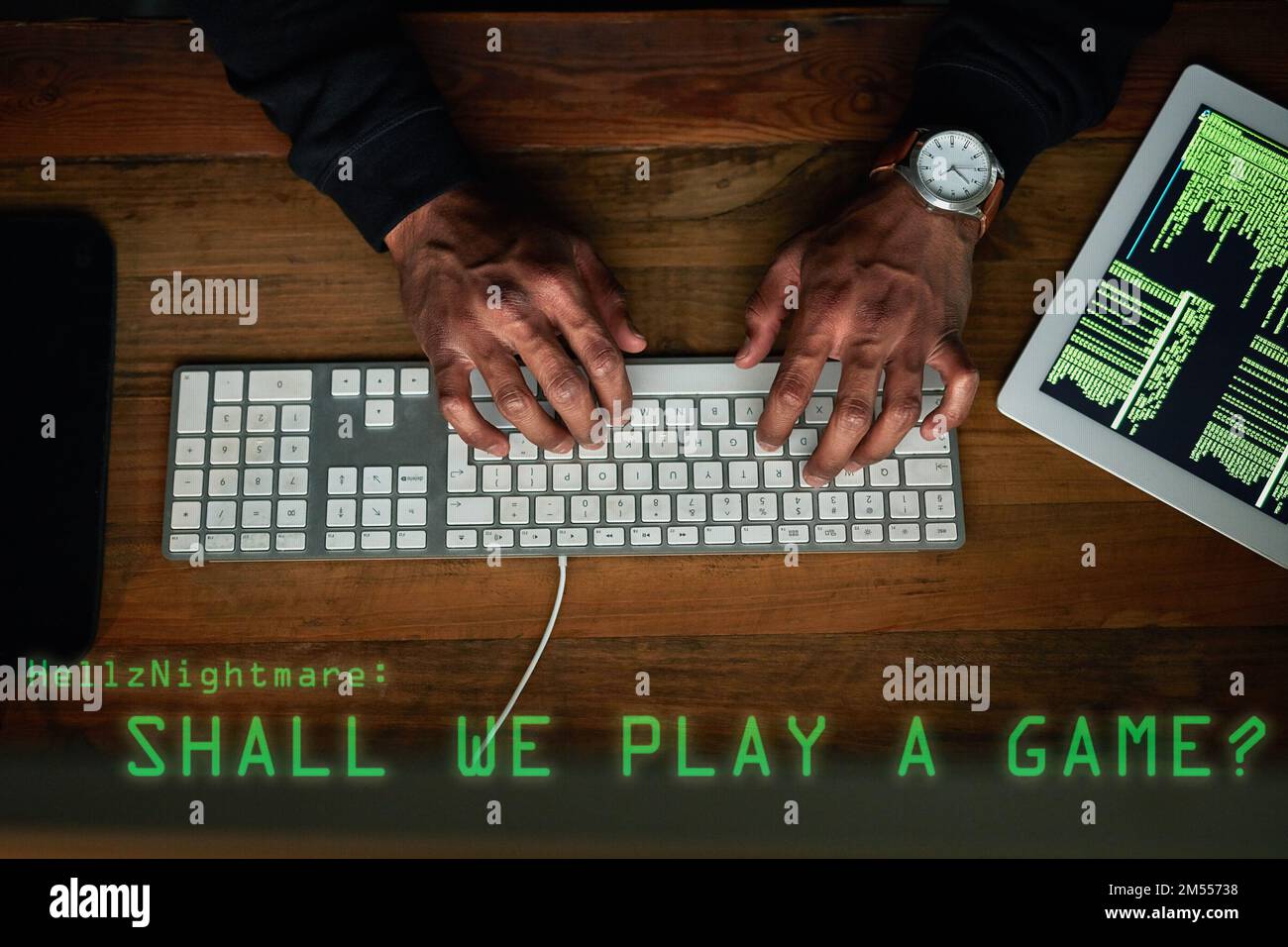 Setting up the sting. High angle shot of an unidentifiable hacker ...