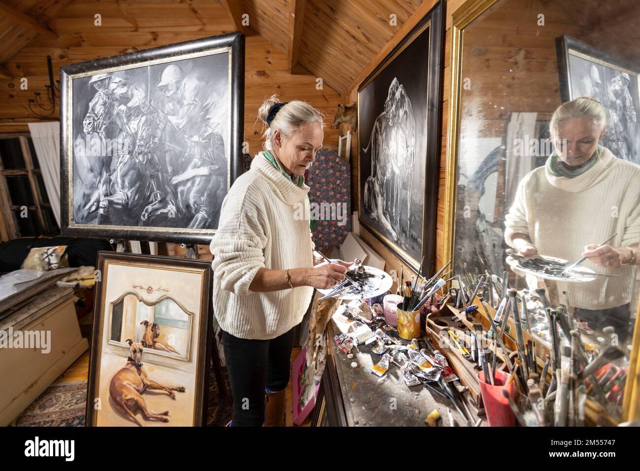 Picture shows artist Debbie Harris working in her garden studio based ...