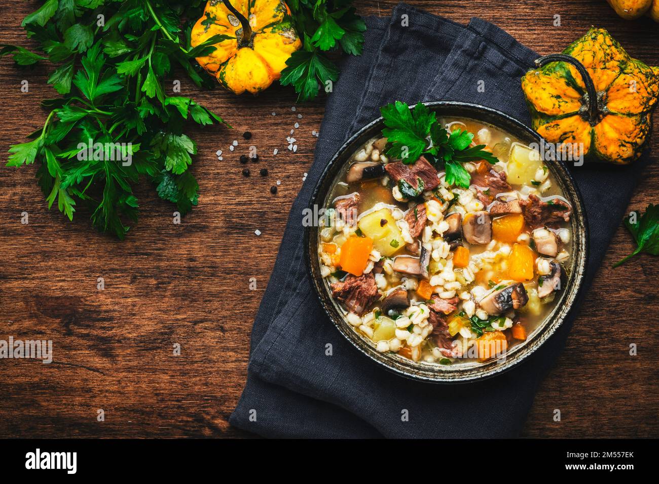 Winter comfort food. Warming soup with pumpkin, mushrooms, vegetables ...