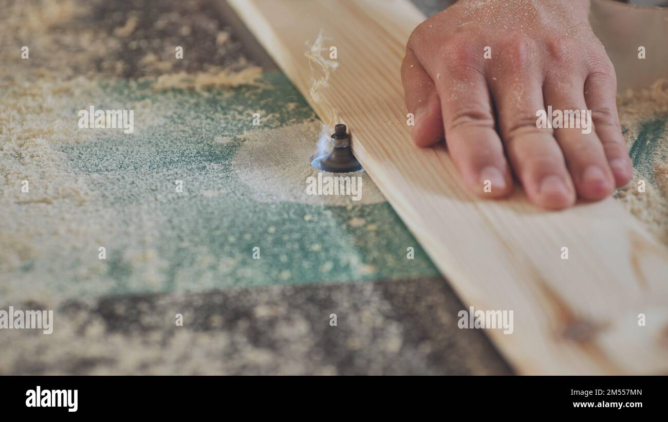 The milling machine processes the board. in summer Stock Photo - Alamy