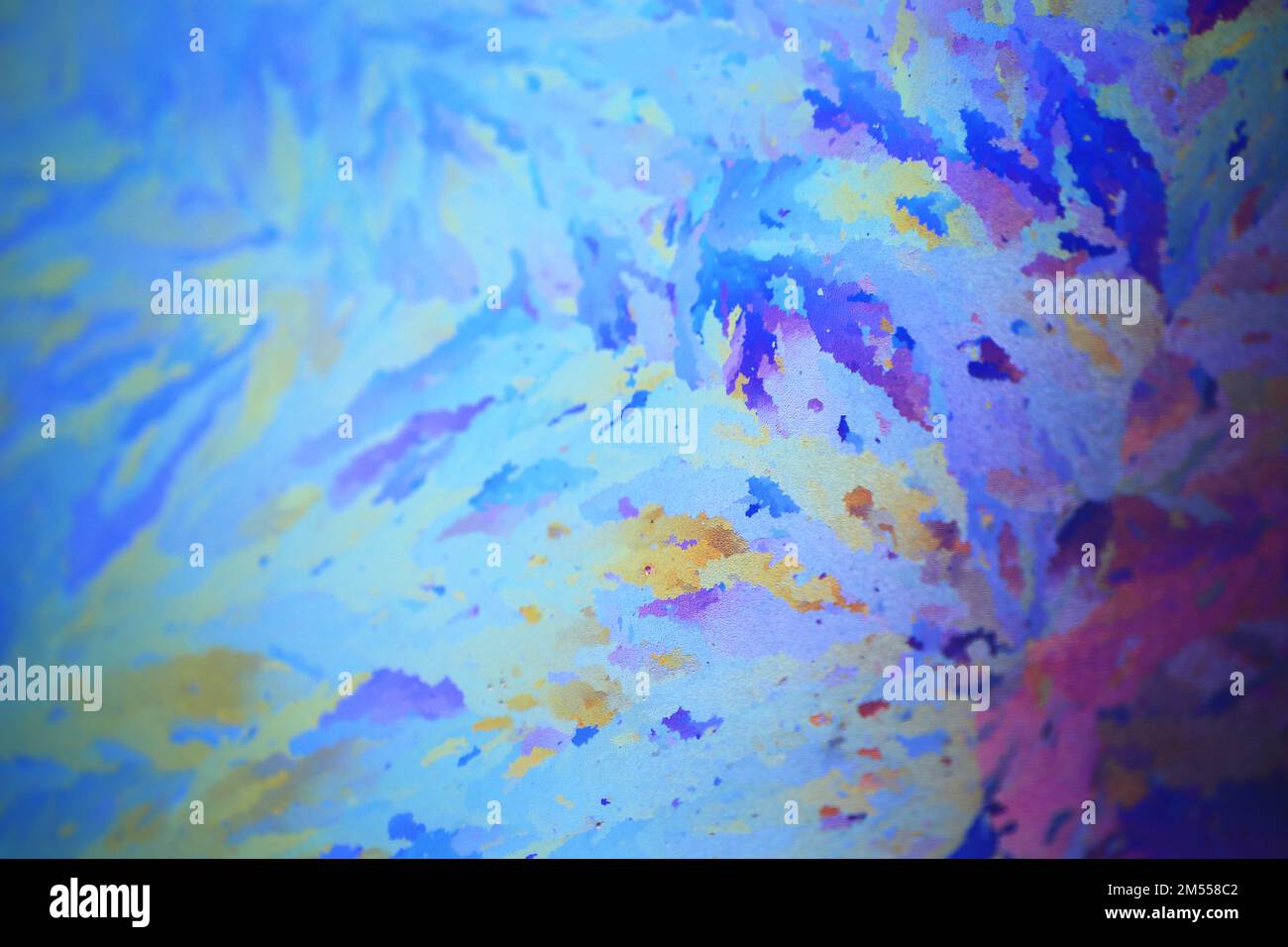 Abstract colorful light effects on window frost, macro in light blue ...