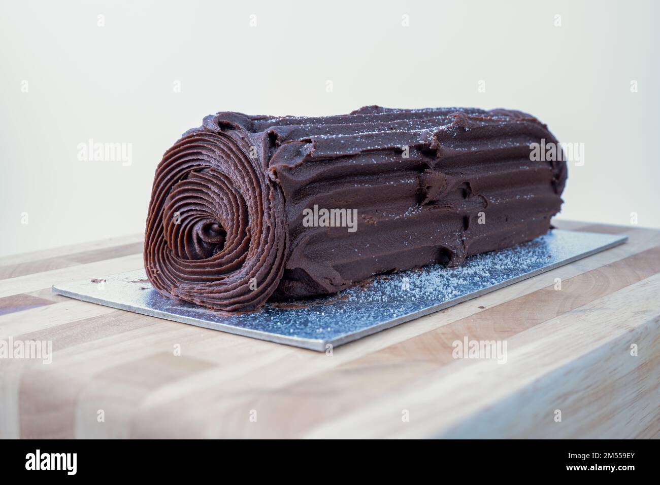 seasonal yuletide christmas chocolate log on a silver presentation ...