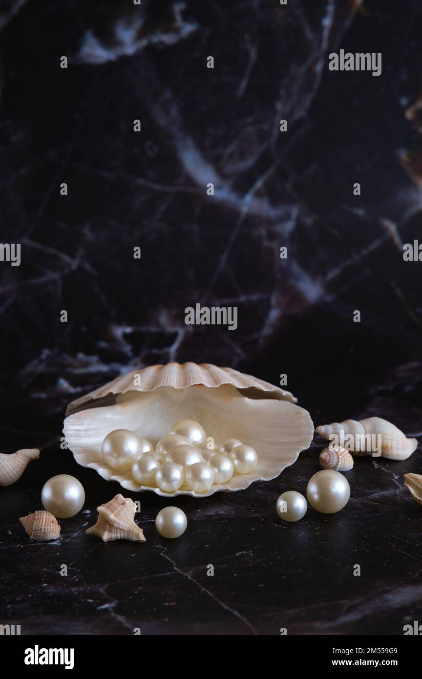 a few pearls in a sea shell Stock Photo - Alamy