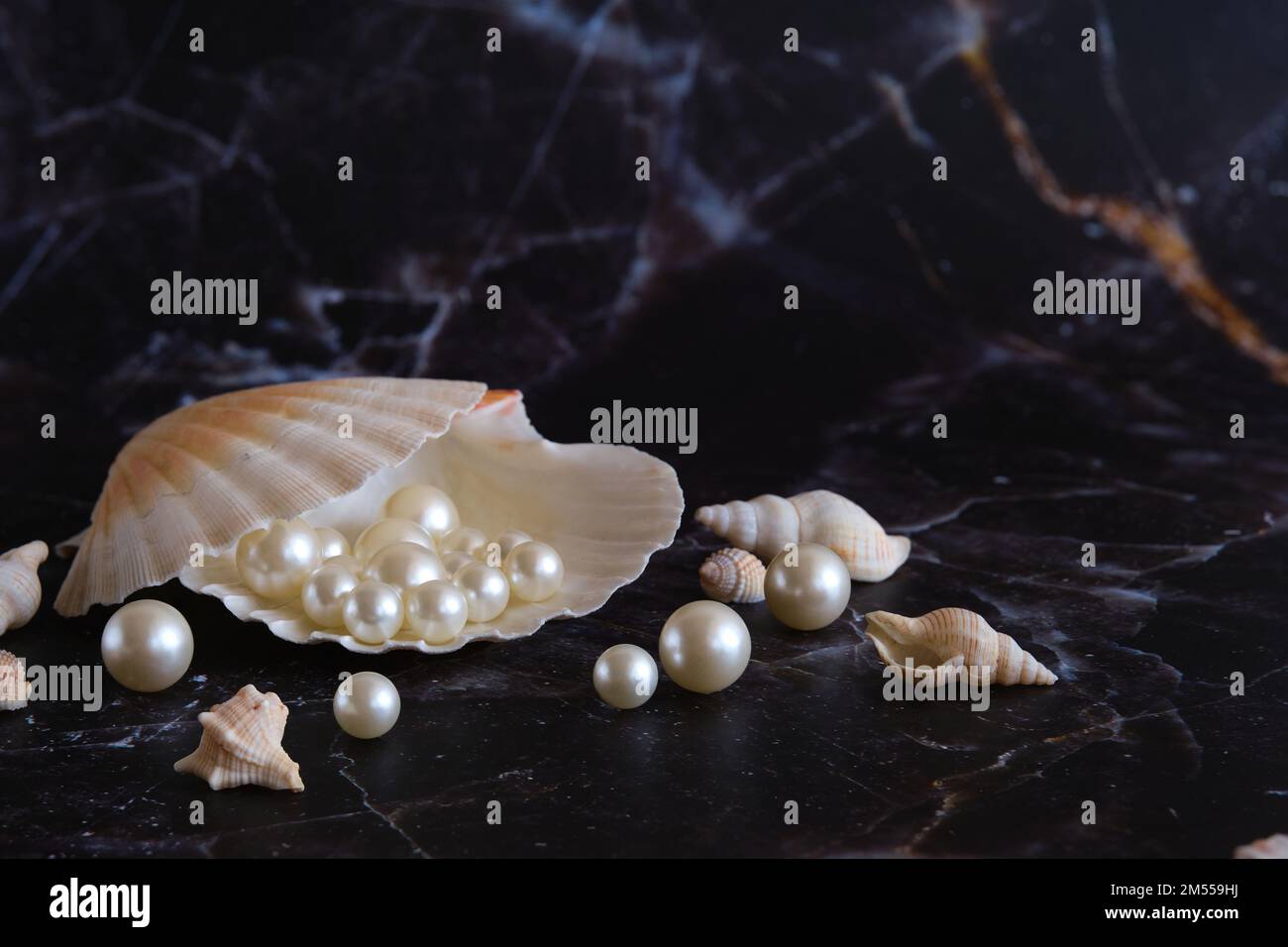 a few pearls in a sea shell Stock Photo - Alamy