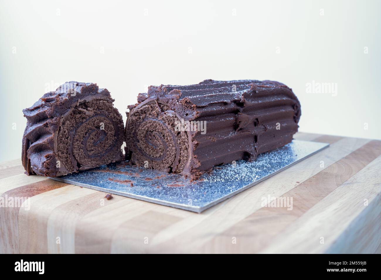 slice of chocolate yuletide christmas log isolated on a white ...
