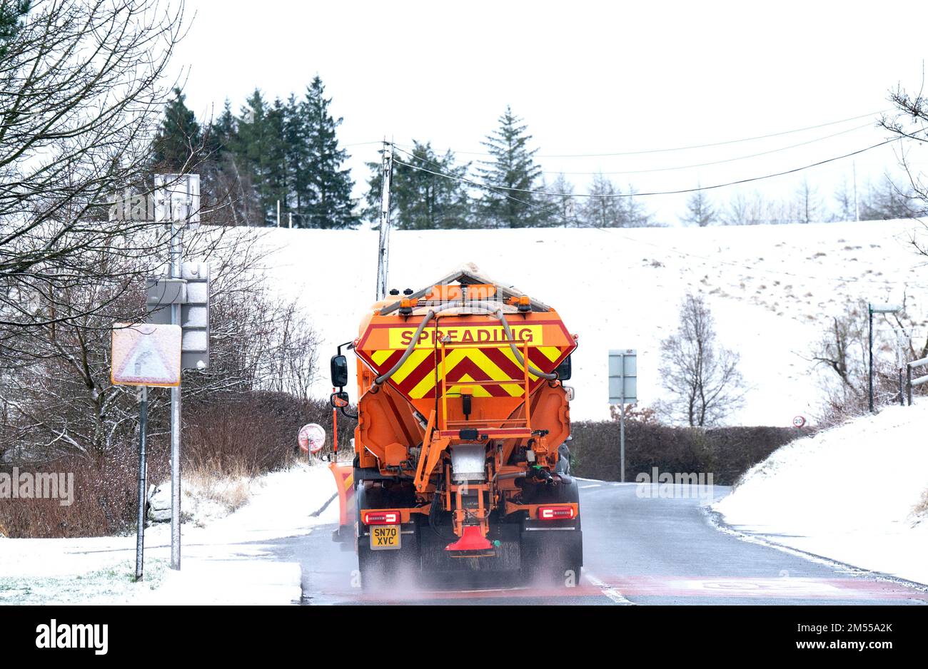 A snow plough makes its way through Carlops in the Scottish Borders. A ...