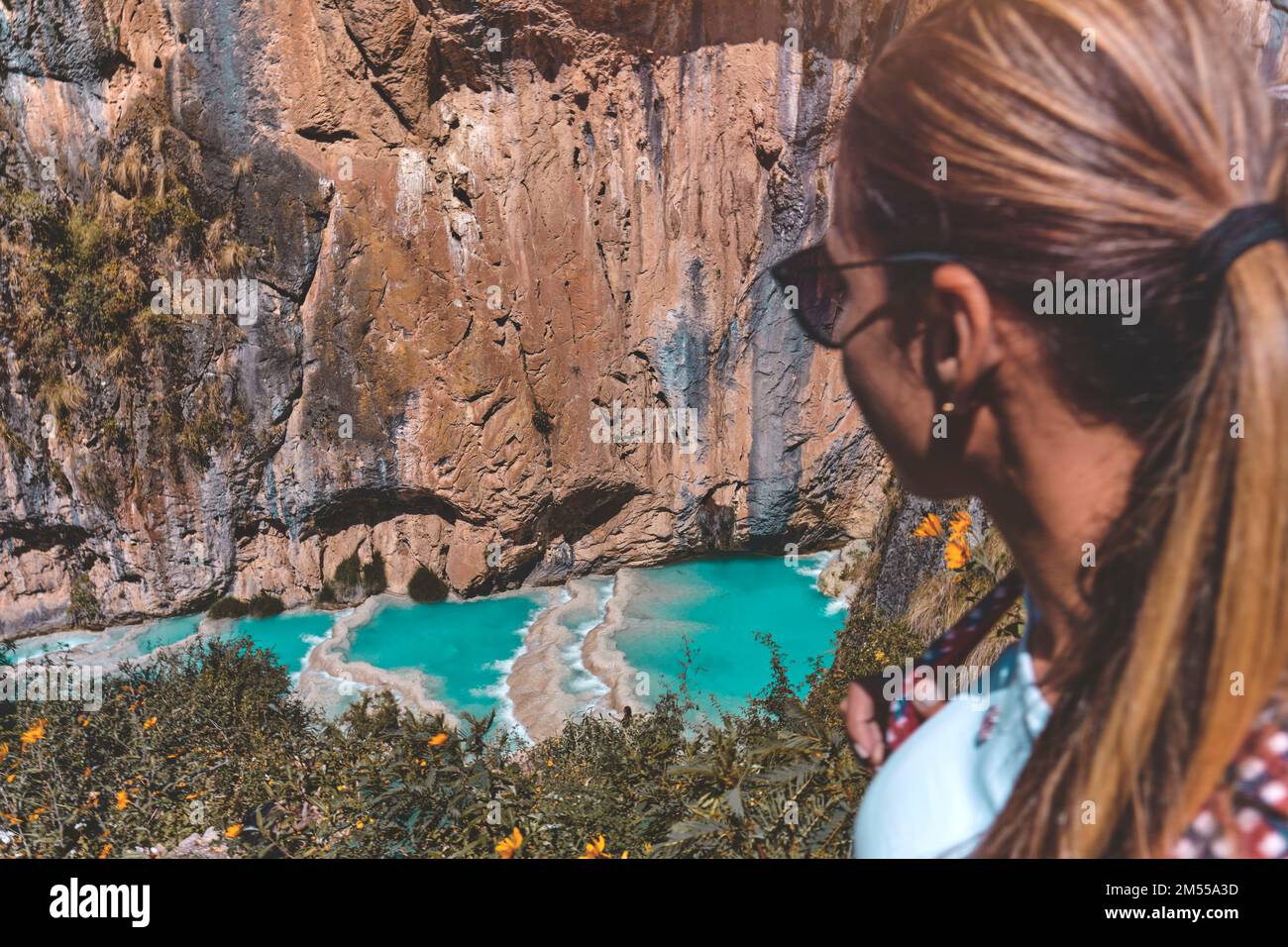 Young woman at viewpoint of the natural pools of Millpu, Ayacucho, Peru ...