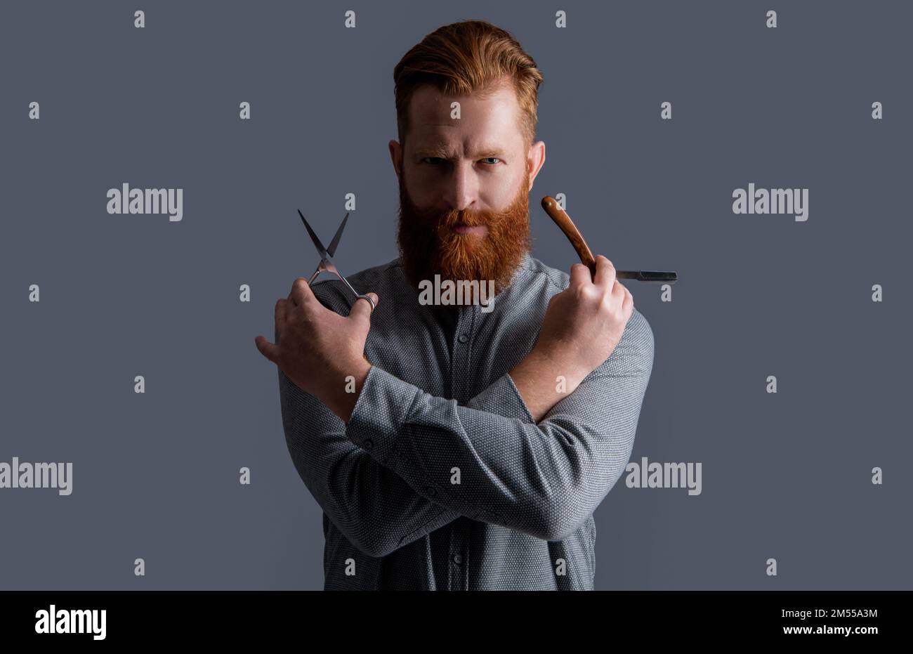 man barber isolated on grey background. man with barber scissors in ...