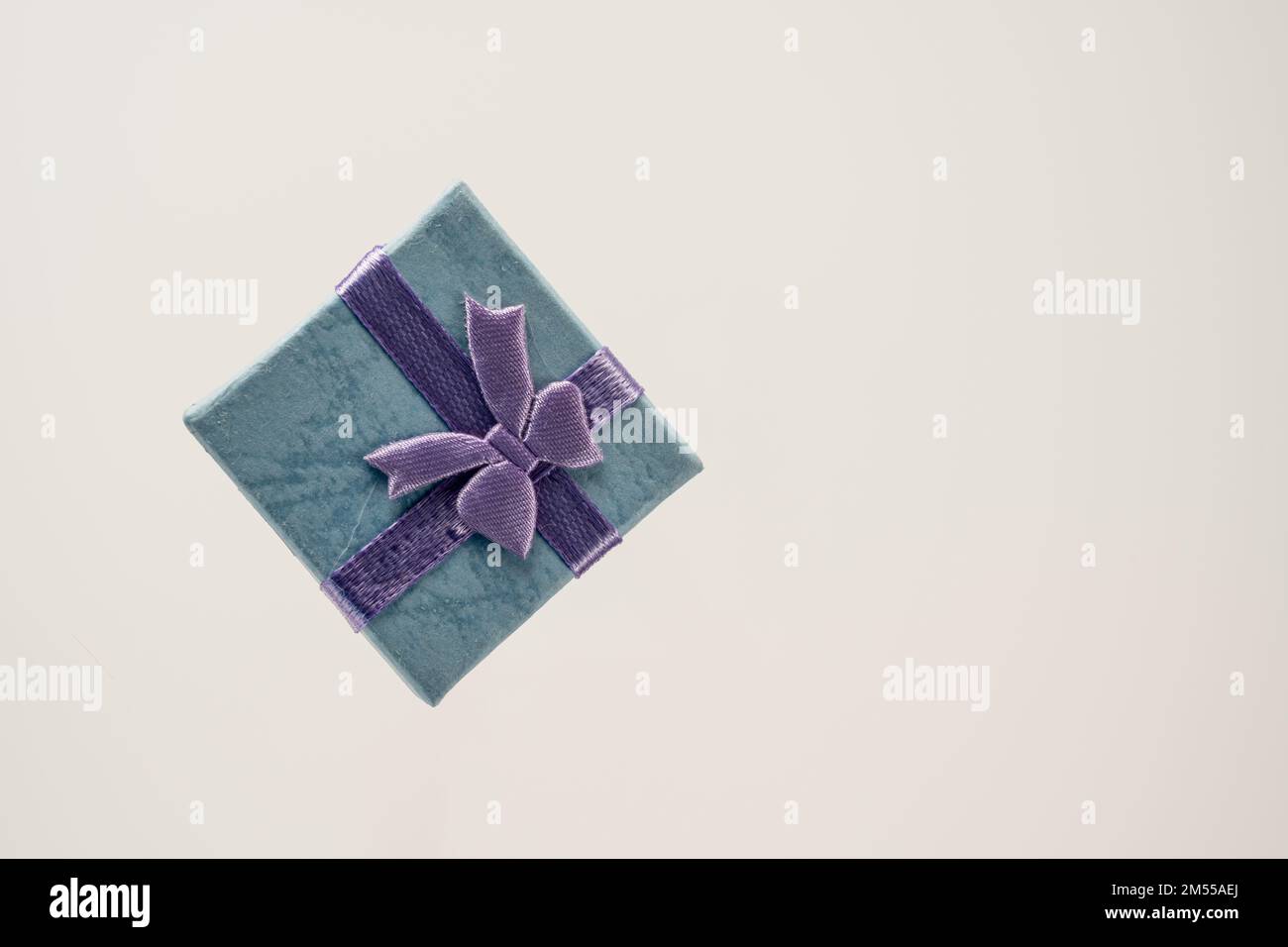 small gift box diamond layout view with ribbon and bow isolated on a ...
