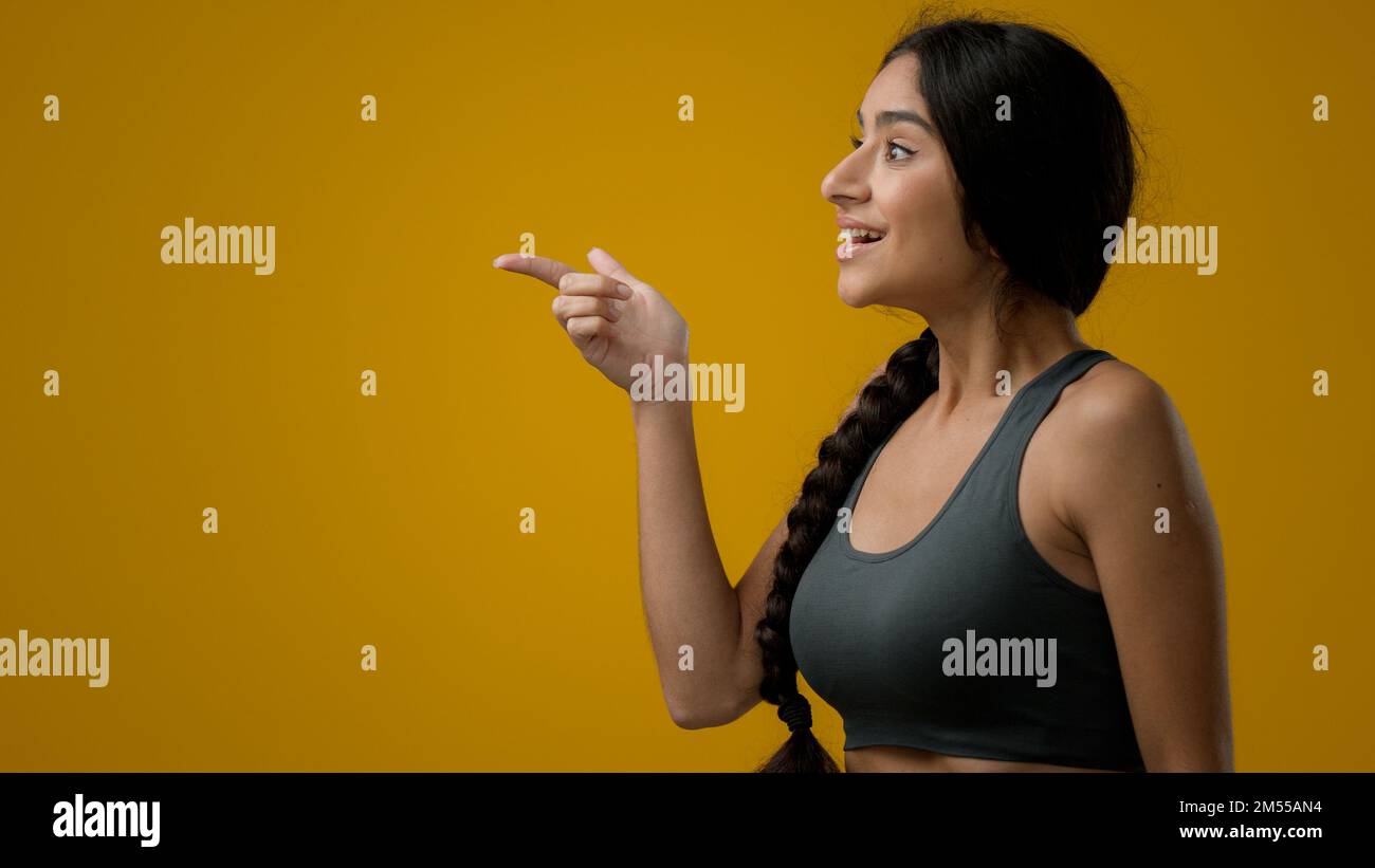 Wonder surprised amazed Indian woman girl female in studio yellow ...