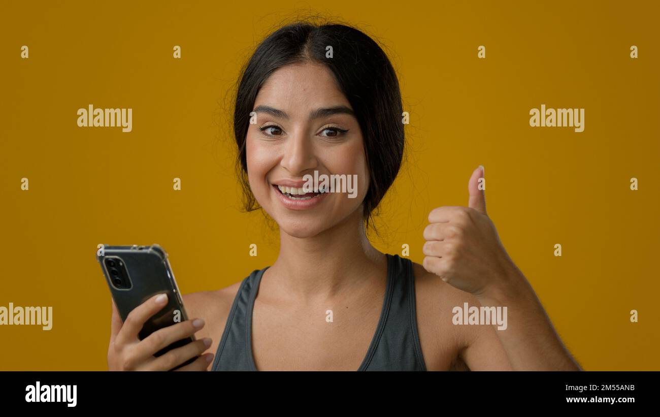 Happy Indian ethnic woman girl lady female smile browsing cell ...