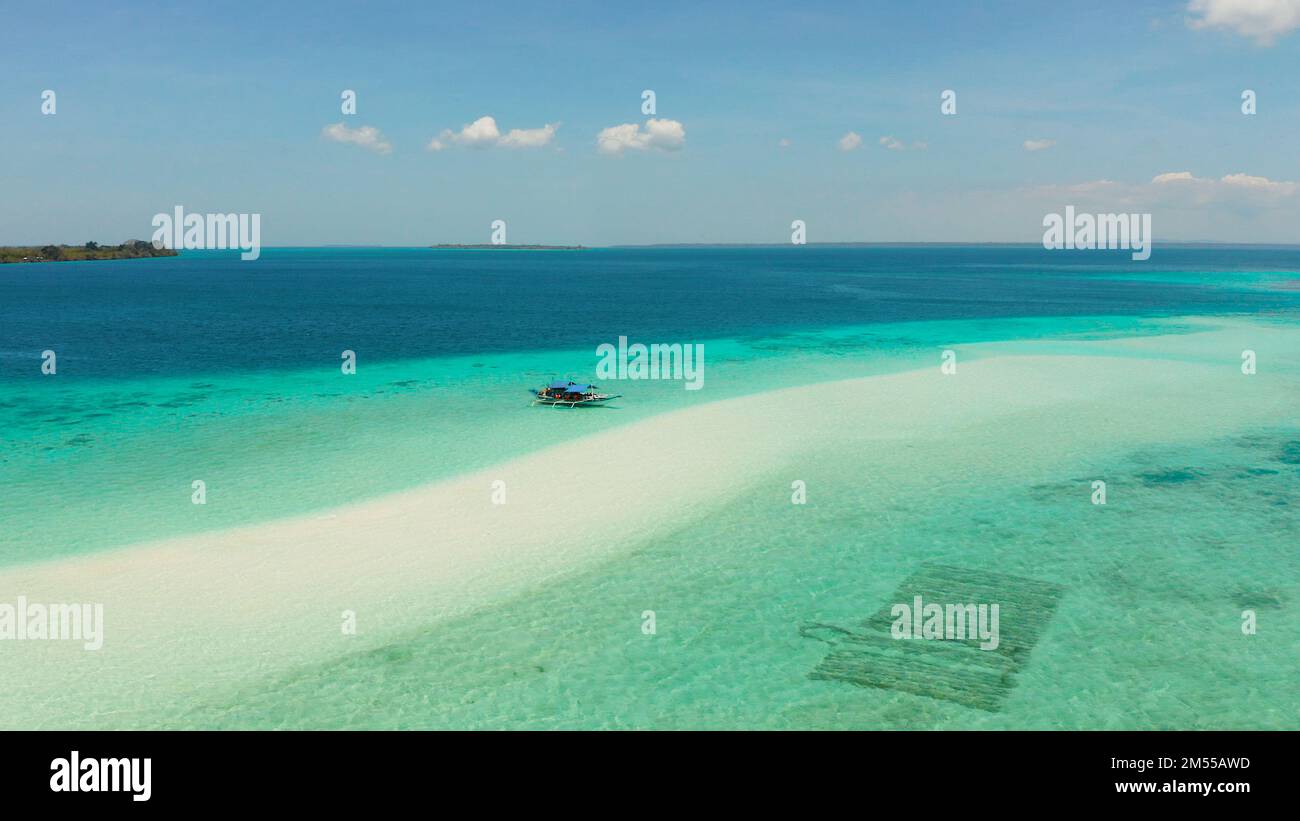 Tropical landscape with a beautiful beach in the blue water and an ...