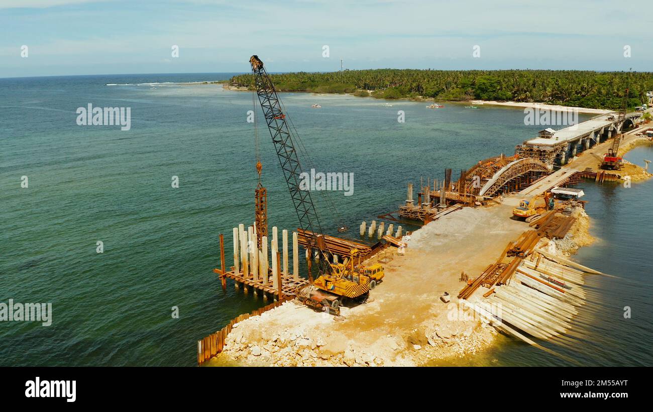 Pile driving is installing concrete pile. Heavy construction equipment ...