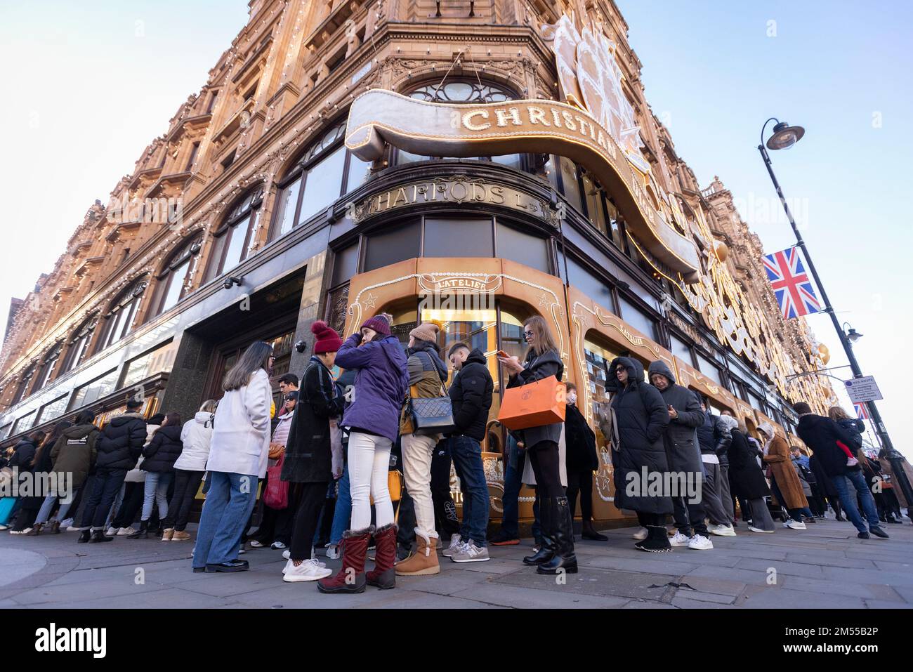 EDITORIAL USE ONLY Customers queue outside Harrods in Knightsbridge ...