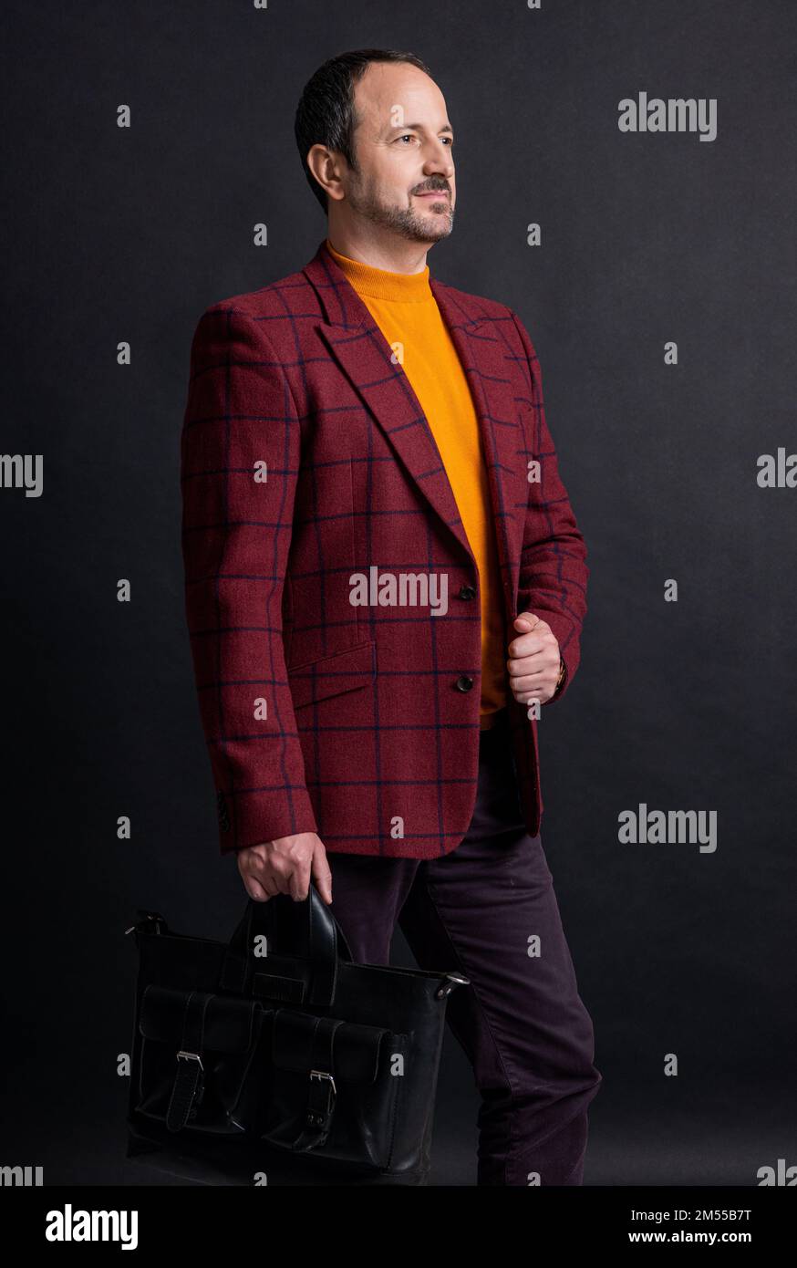 briefcase for caucasian trendy man. photo of mature man holding leather ...