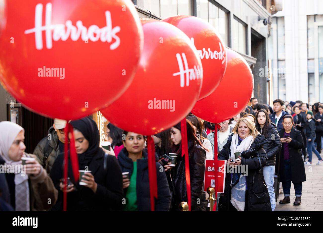 EDITORIAL USE ONLY Customers queue outside Harrods in Knightsbridge ...