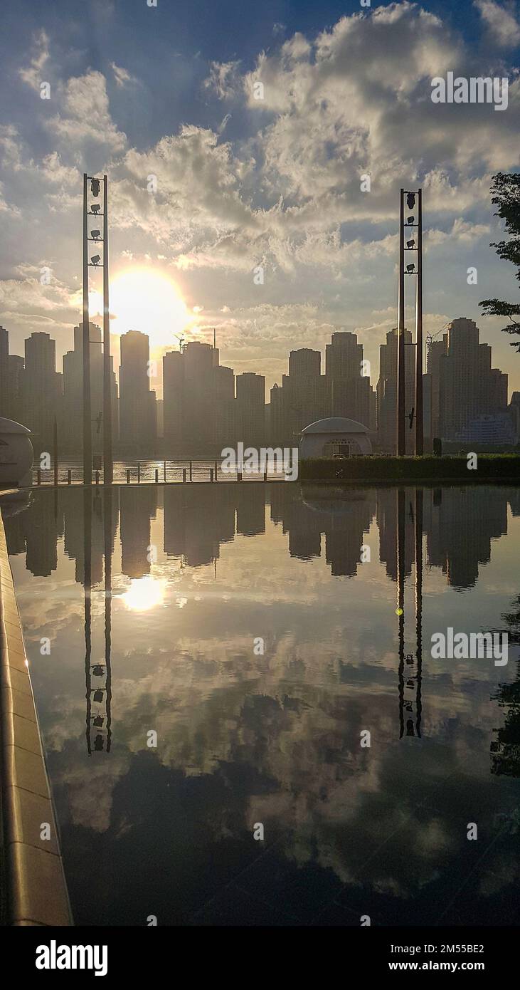 Panoramic view of Business Bay district with reflection in sea in ...