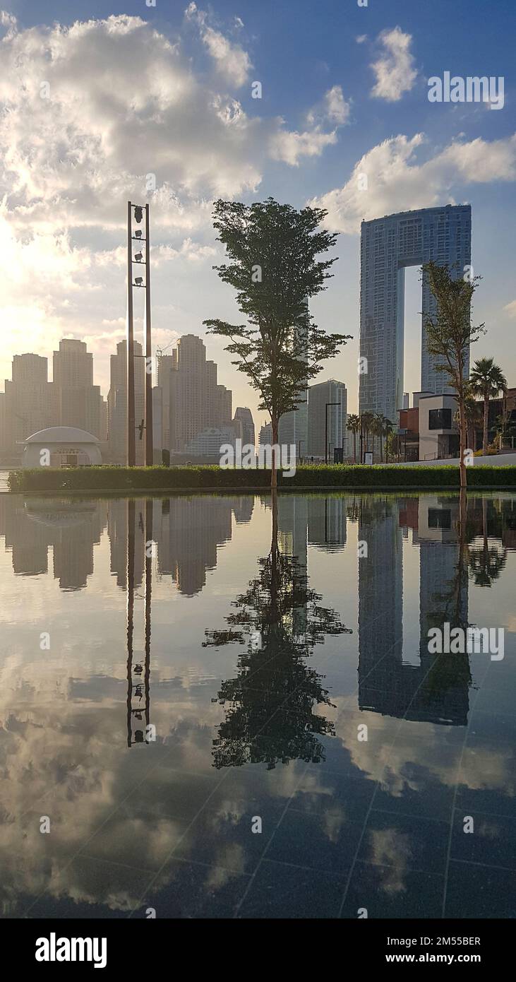 Panoramic view of Business Bay district with reflection in sea in ...