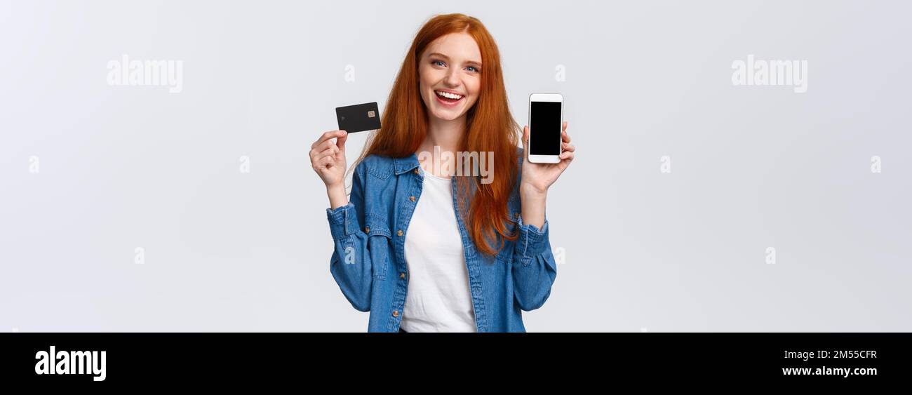 Shopping, application and mobile concept. Waist-up portrait friendly ...