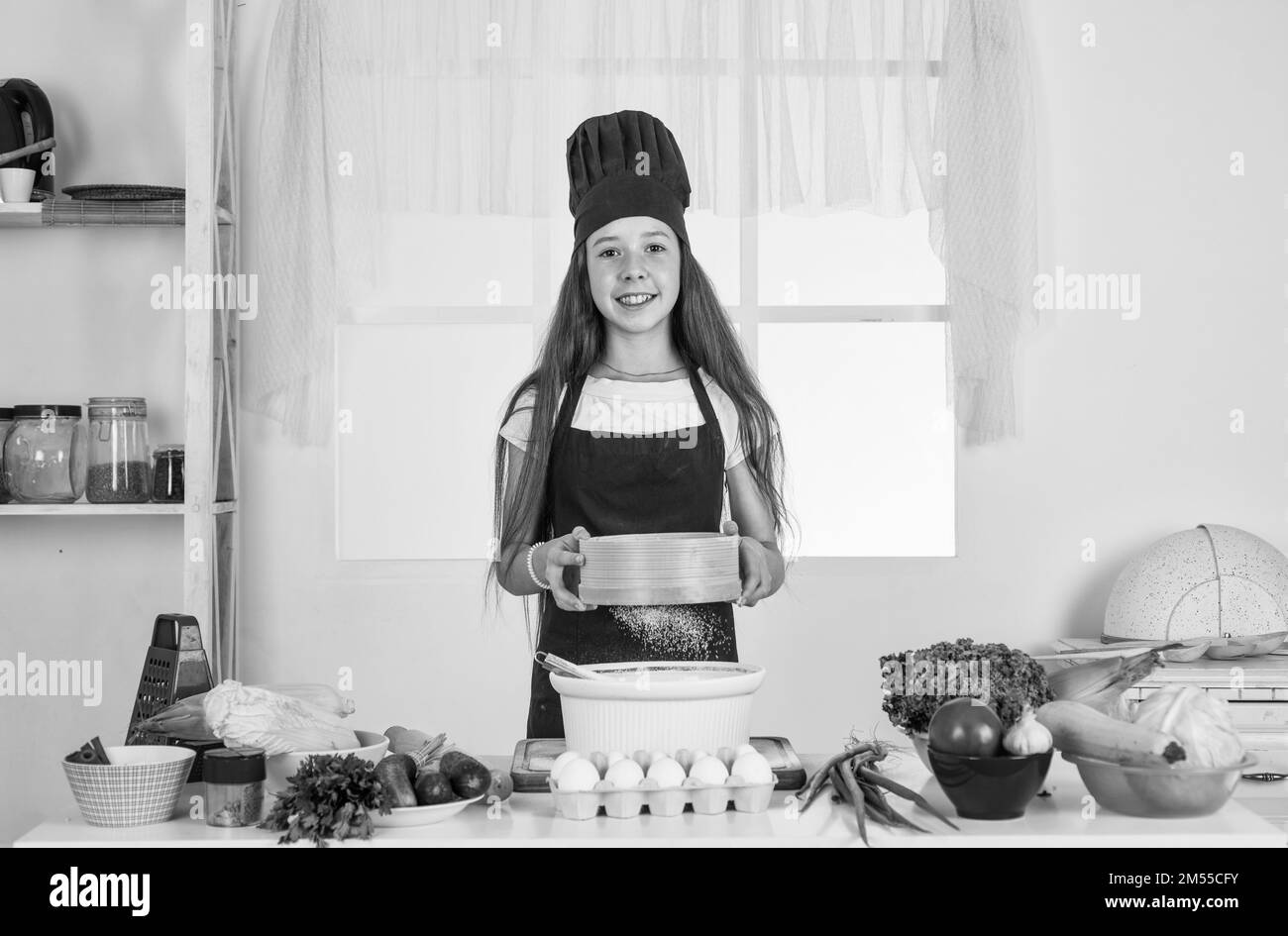 teen girl in cook uniform prepare food in kitchen, culinary Stock Photo ...