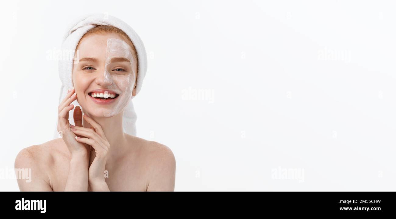 beautiful model applying cosmetic cream treatment on her face on white ...