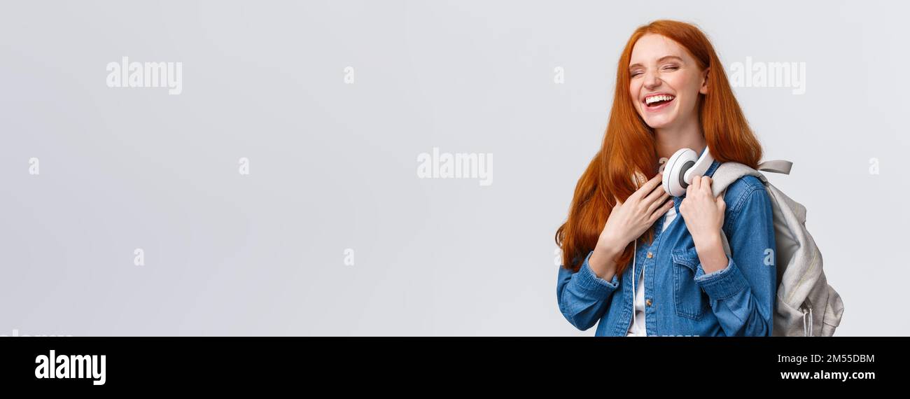 Charismatic and cheerful, lovely friendly redhead girl laughing over ...