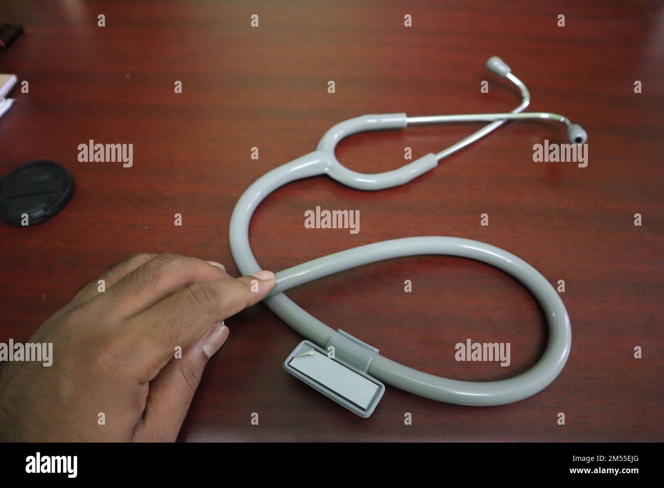 Hand holding stethoscope listening hi-res stock photography and images ...