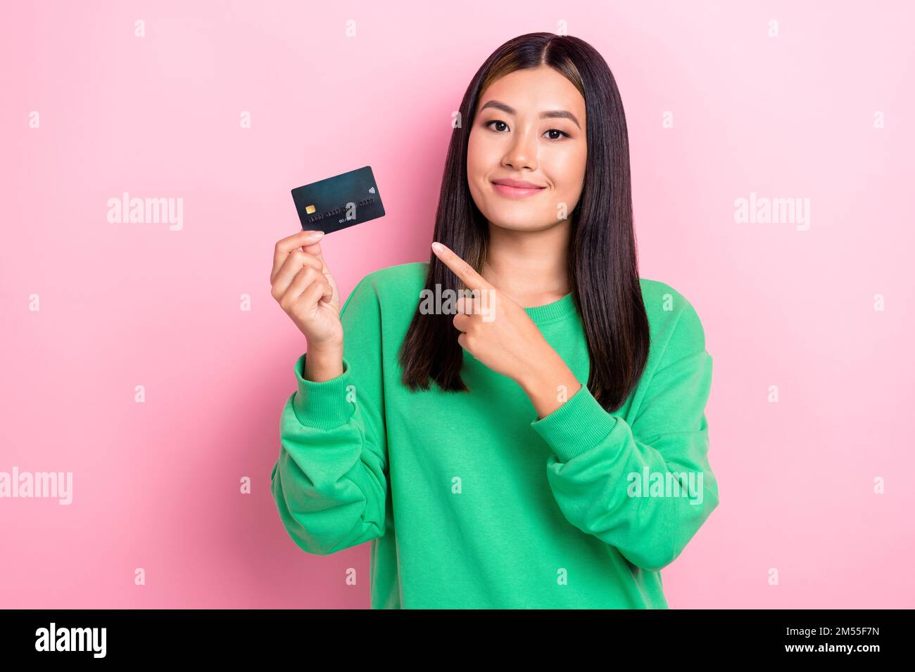 Photo of charming indonesian lady direct finger arm hold plastic debit ...