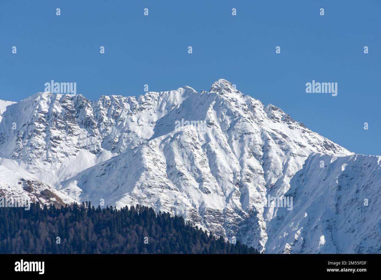 Mountain snowy landscape forest, mountain range pass blue sky Stock ...