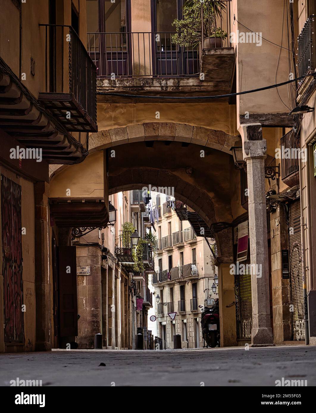A beautiful alley with historic buildings in the gothic quarter of ...