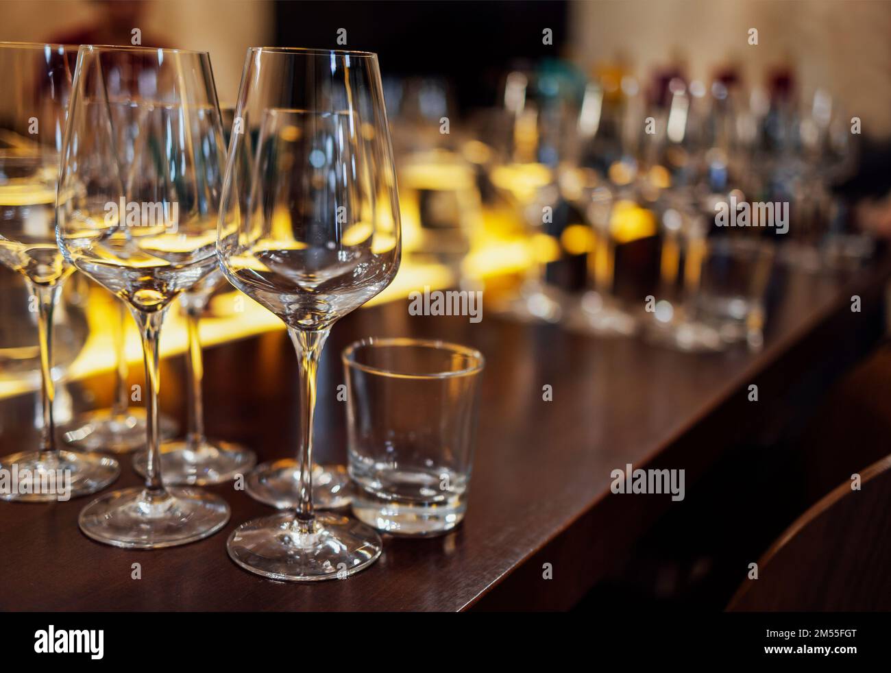 Glass goblets placed in rows on table during wine tasting procedure in ...