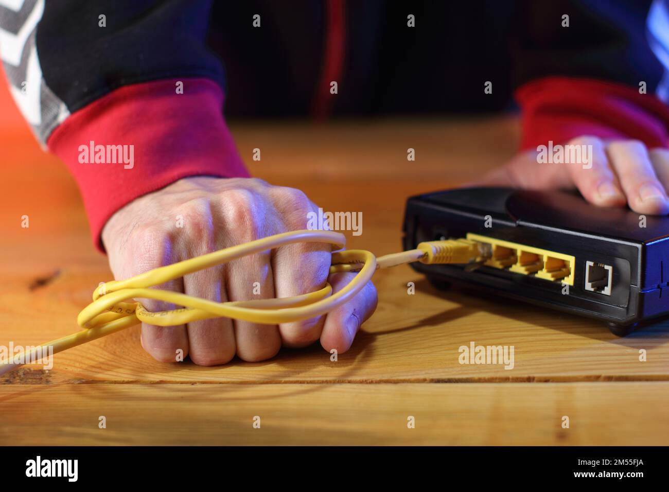 tearing with force the internet cable from the adsl modem by a person ...