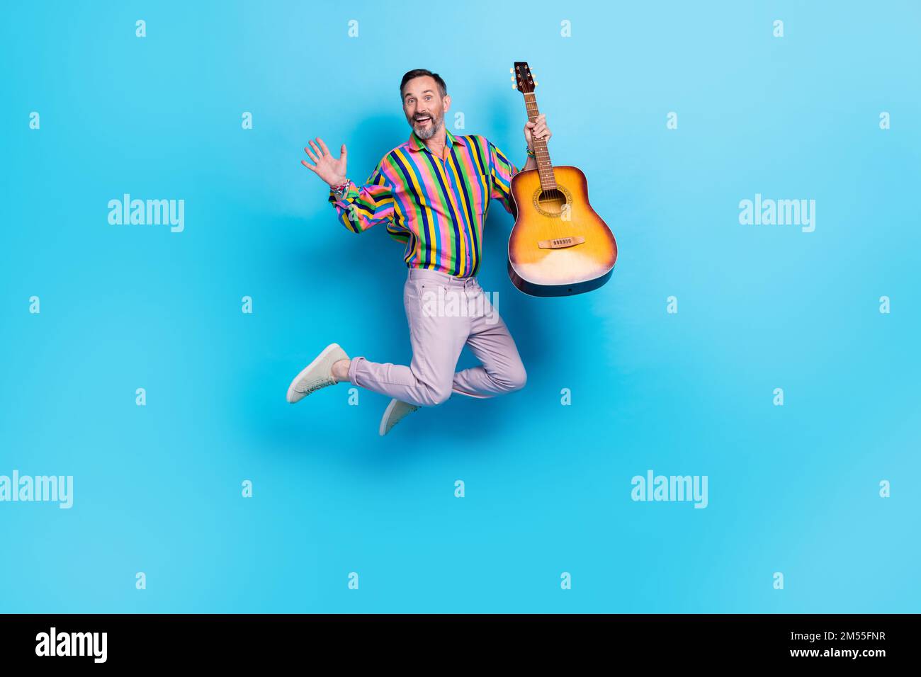 Full length photo of overjoyed positive man rejoice win vocal contest ...