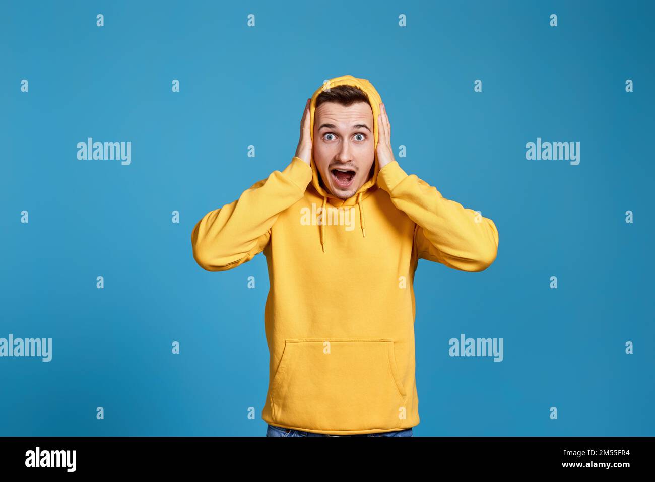 shocked man with round eyes, open mouth and hands Stock Photo - Alamy